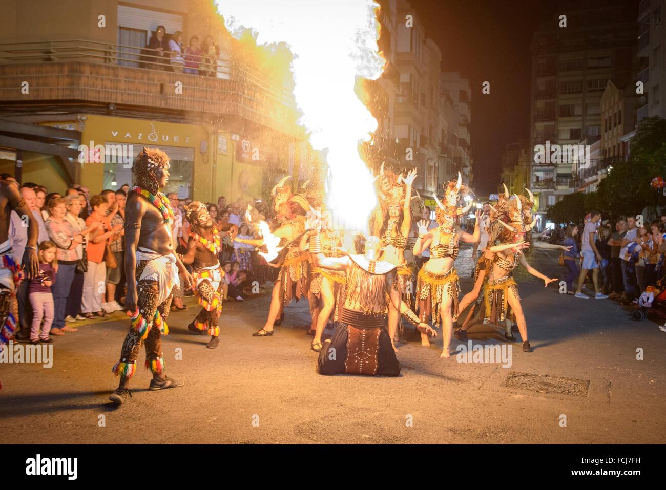 Fire eaters with African ancestral costumes dancing in parades ...