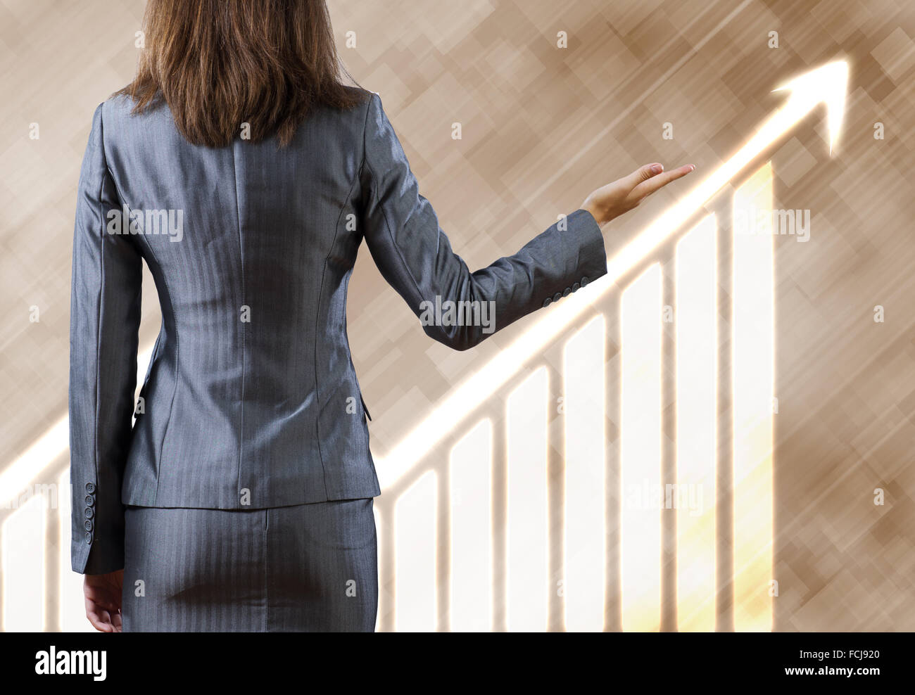 Rear view of businesswoman pointing at growth graph hi-res stock ...