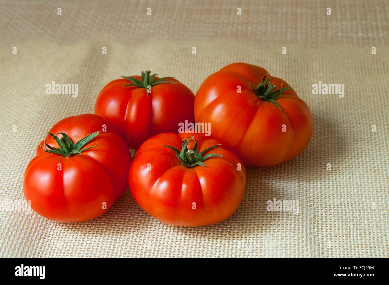 Four tomatoes. Still life Stock Photo - Alamy