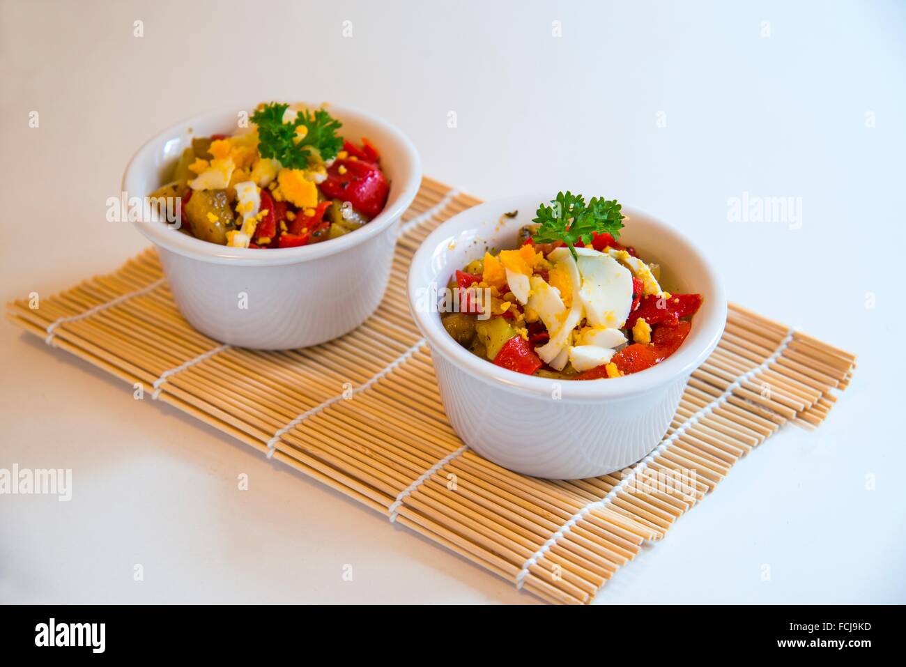 Two bowls with cooked vegetables Stock Photo - Alamy