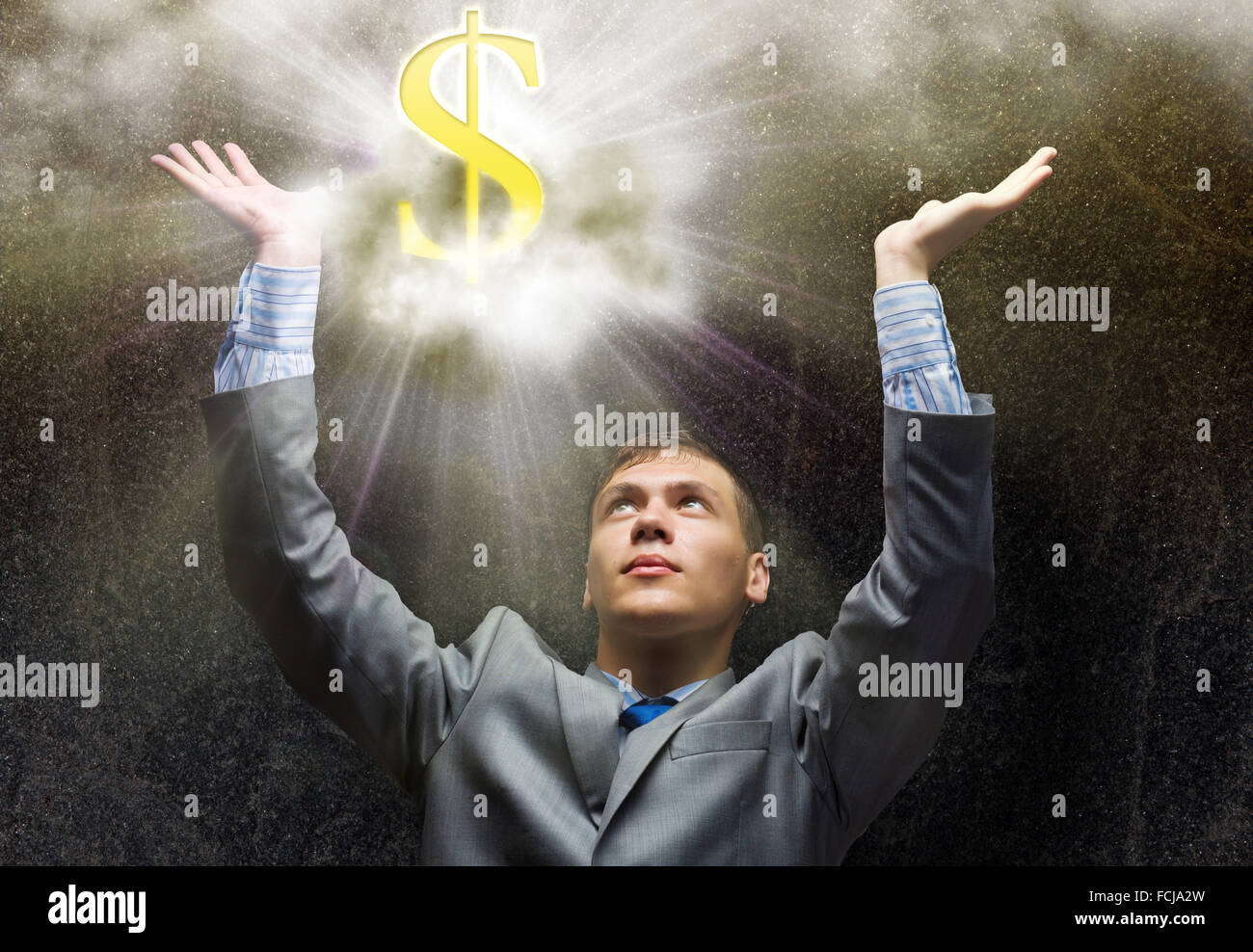 Businessman praying at dollar sign above Stock Photo - Alamy