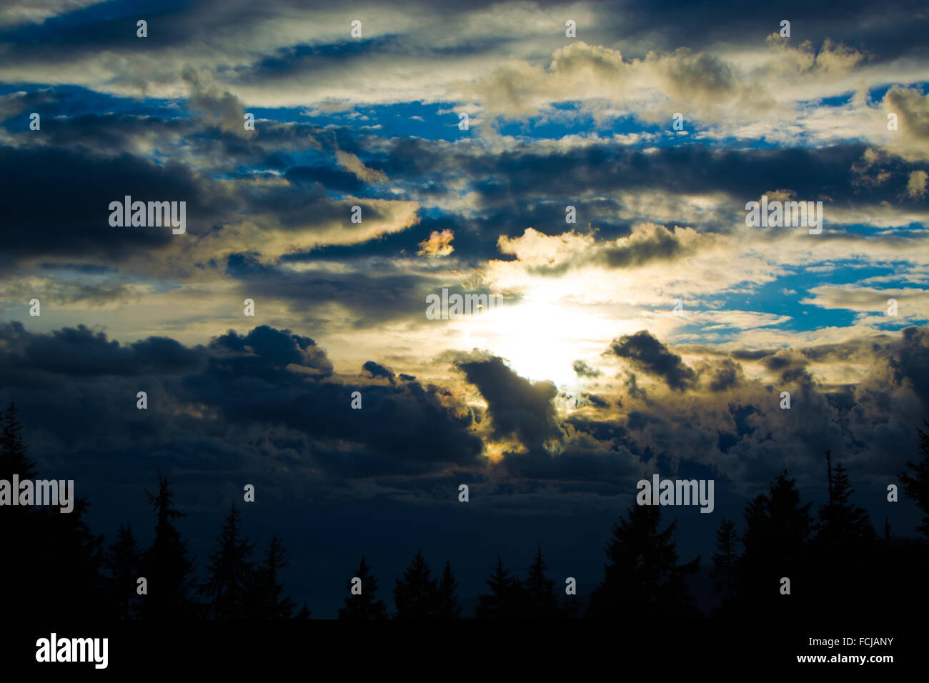 A view of the sun through the clouds from Cypress Mountain Stock Photo ...