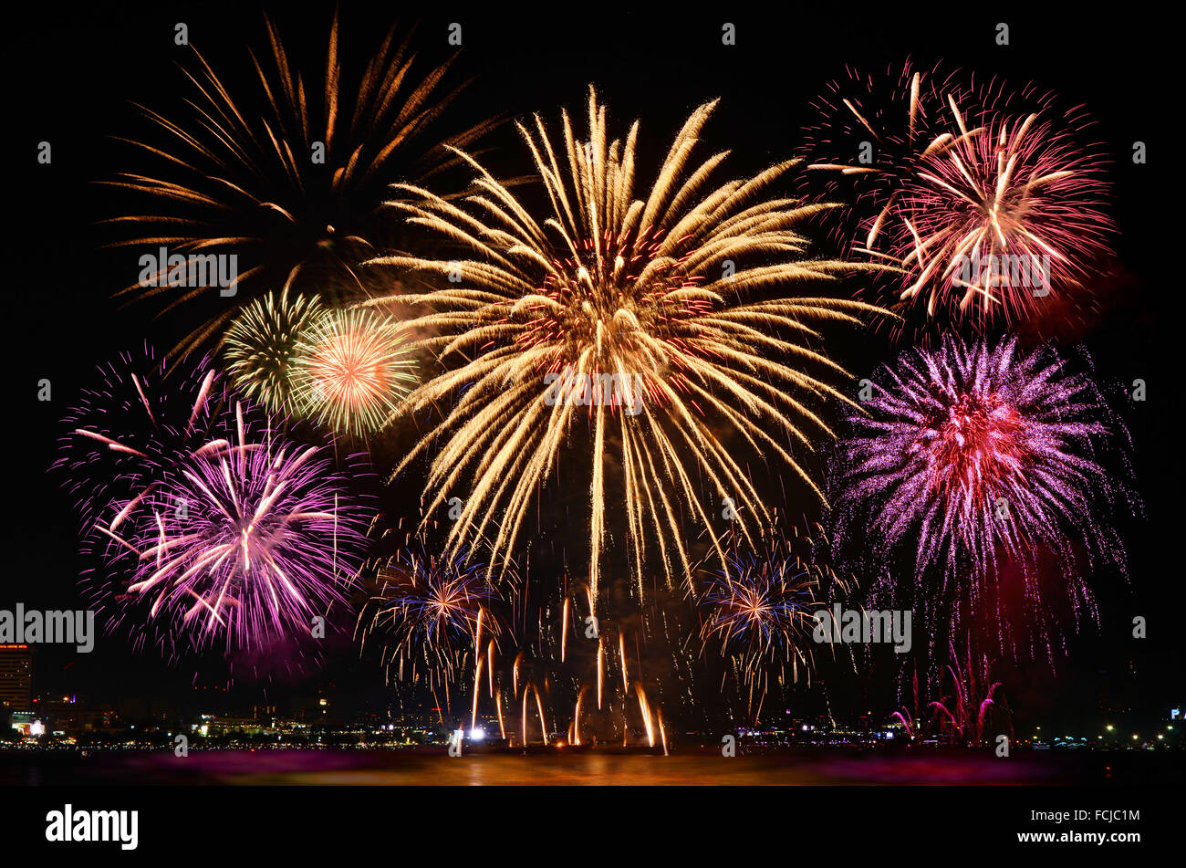 Colorful firework celebration from the sea shore Stock Photo - Alamy
