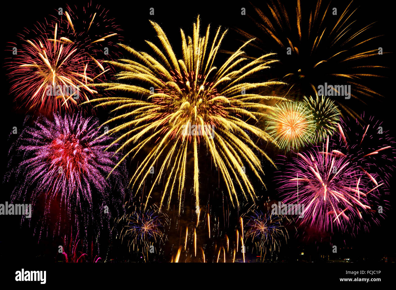 Colorful fireworks celebration on dark background Stock Photo - Alamy