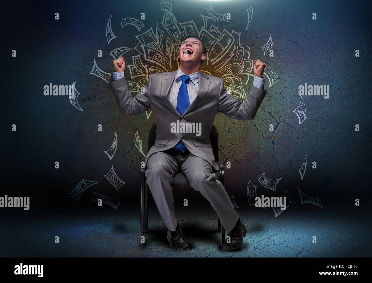Cheerful businessman sitting on chair and screaming ahead Stock Photo ...