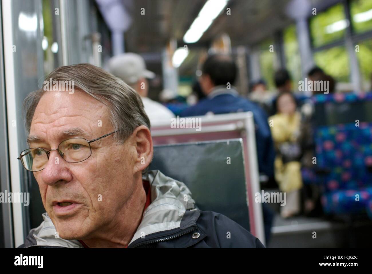 Senior man on a bus Stock Photo - Alamy