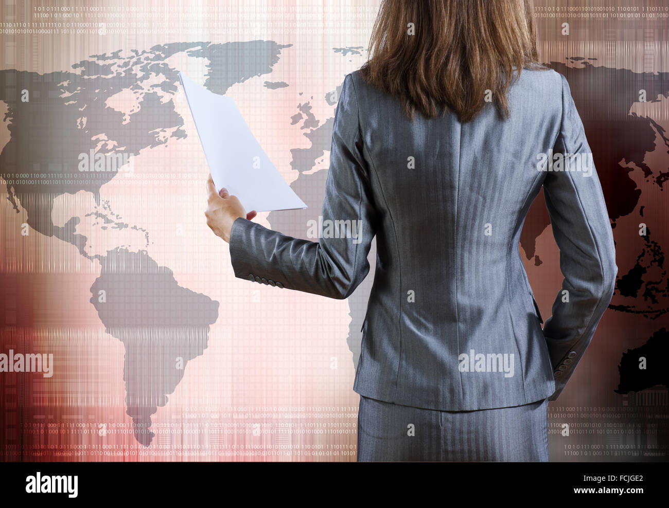 Rear view of businesswoman against digital blue background Stock Photo ...