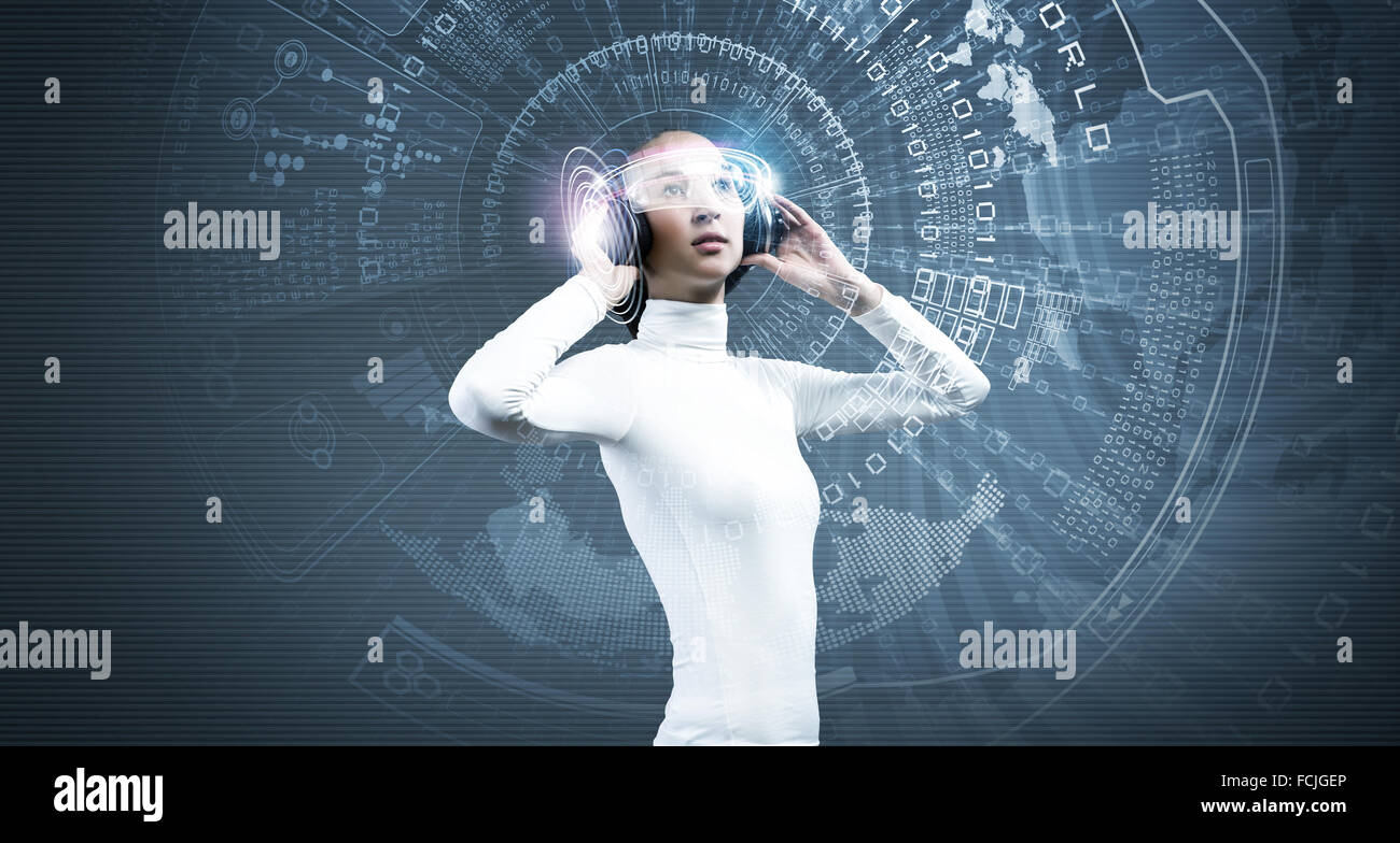 Young woman in white wearing headphones. High-tech concept Stock Photo ...