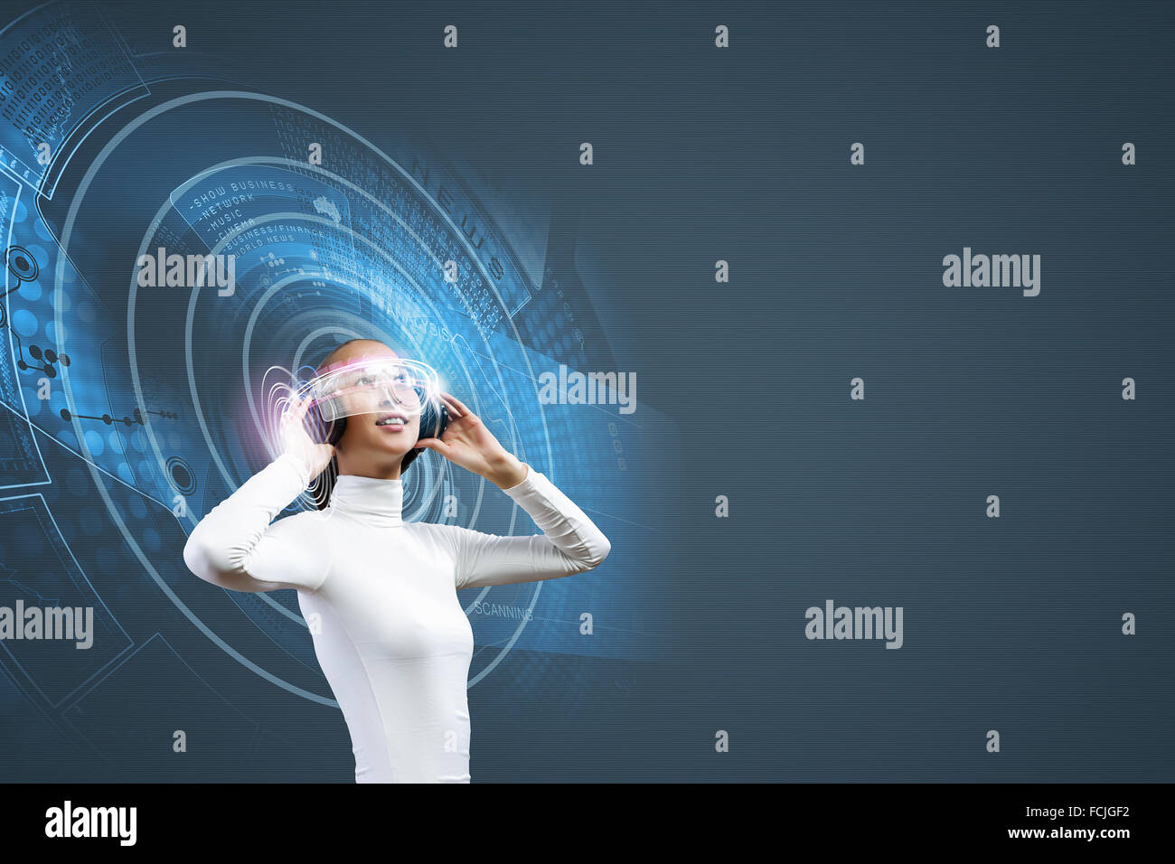 Young woman in white wearing headphones. High-tech concept Stock Photo ...