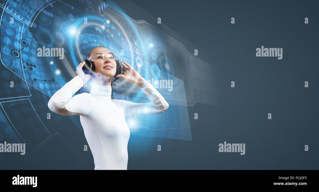 Young woman in white wearing headphones. High-tech concept Stock Photo ...