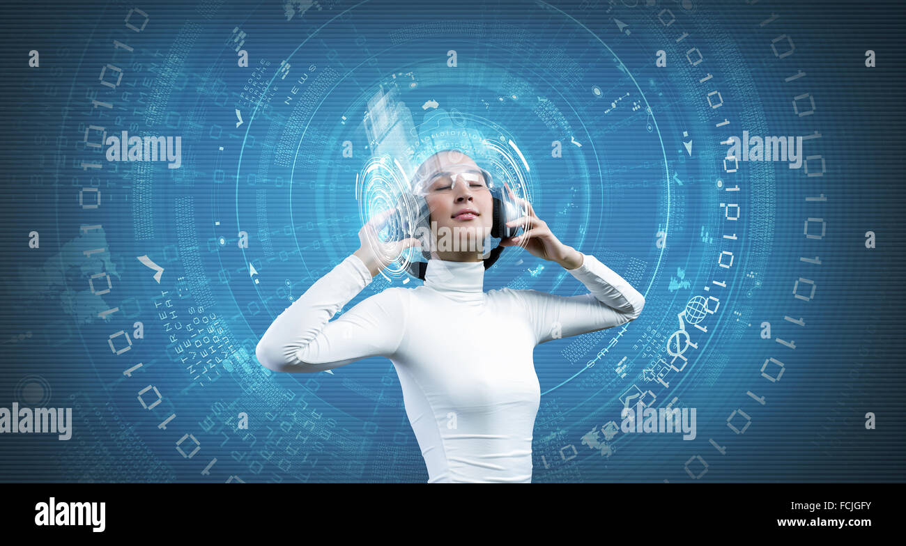 Young woman in white wearing headphones. High-tech concept Stock Photo ...