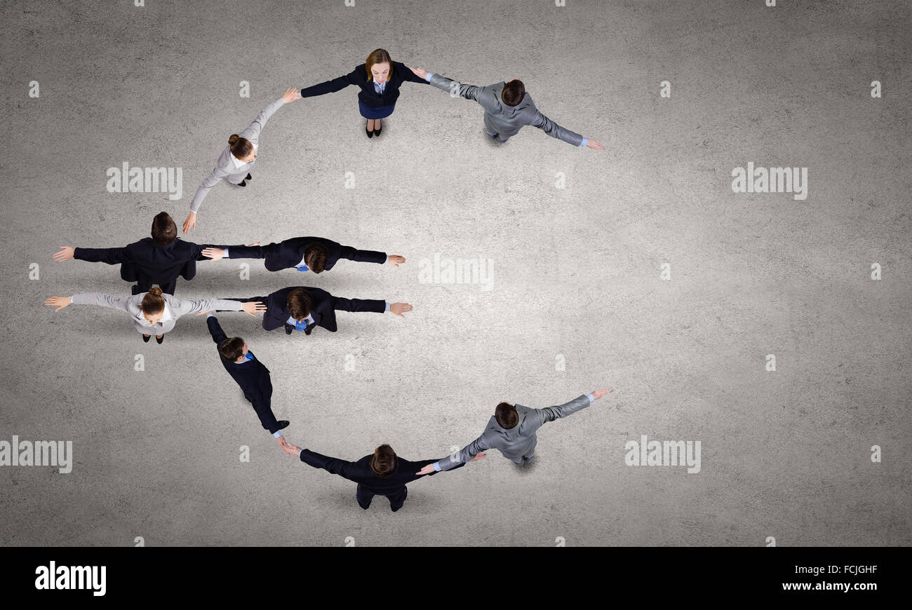 Group of business people standing in circle Stock Photo - Alamy