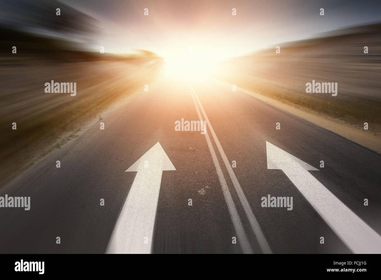 Conceptual image of asphalt road and direction arrow Stock Photo - Alamy