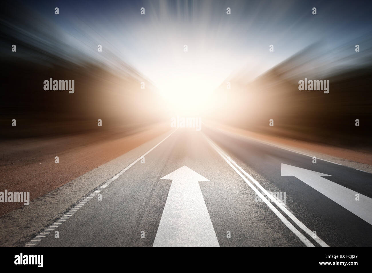Conceptual image of asphalt road and direction arrow Stock Photo - Alamy