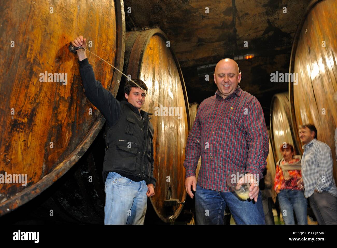 â. œtxotx tasteâ.drinking cider straight from de huge wood barrel ...