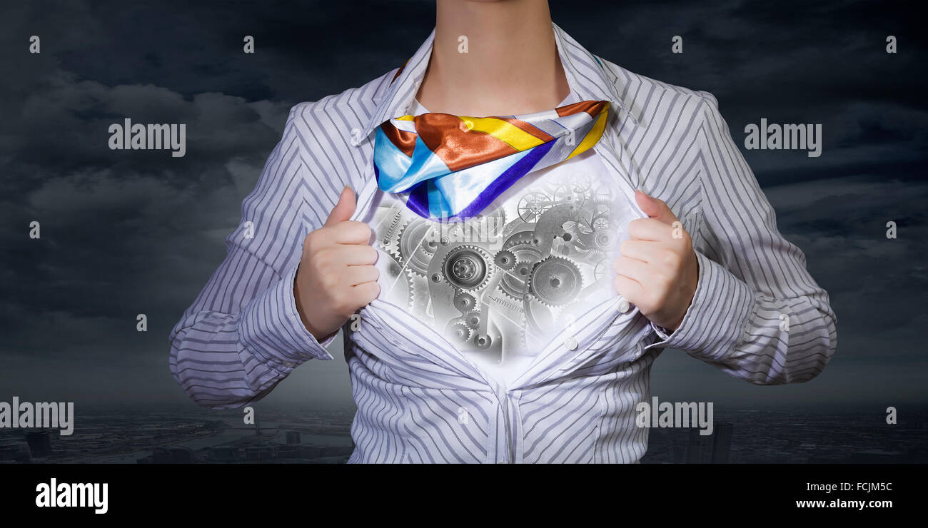Young woman tearing shirt on chest. Mechanism concept Stock Photo - Alamy