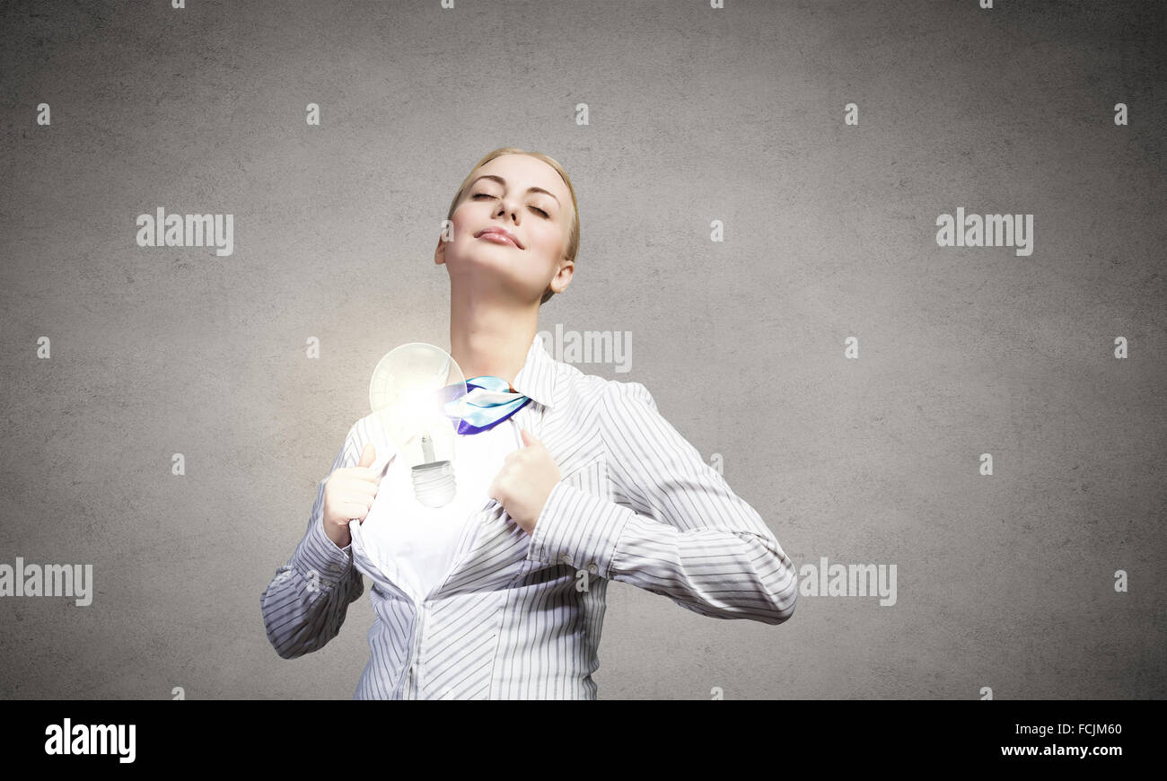 Young woman tearing shirt on chest. Idea concept Stock Photo - Alamy