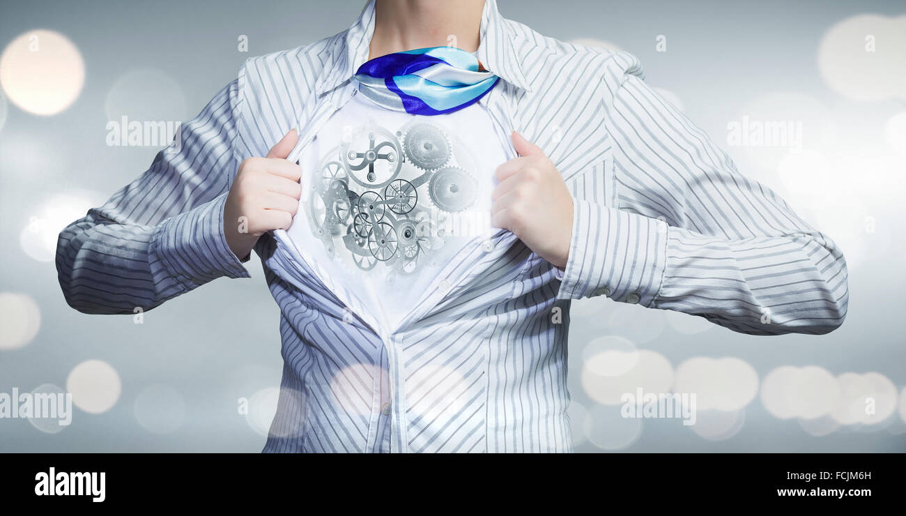 Young woman tearing shirt on chest. Mechanism concept Stock Photo - Alamy