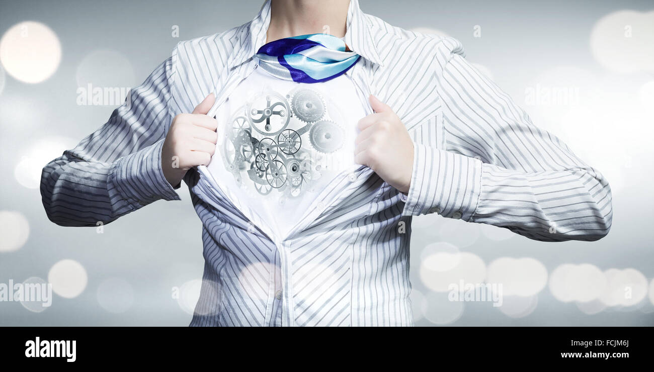 Young woman tearing shirt on chest. Mechanism concept Stock Photo - Alamy