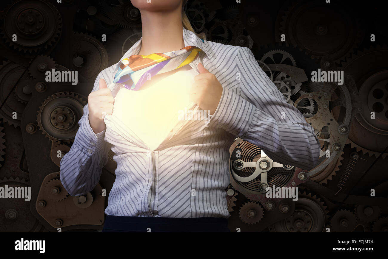 Young woman tearing shirt on chest. Mechanism concept Stock Photo - Alamy