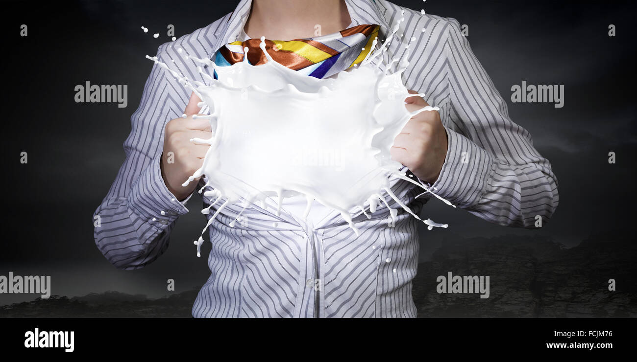 Young woman tearing shirt on chest. Idea concept Stock Photo - Alamy