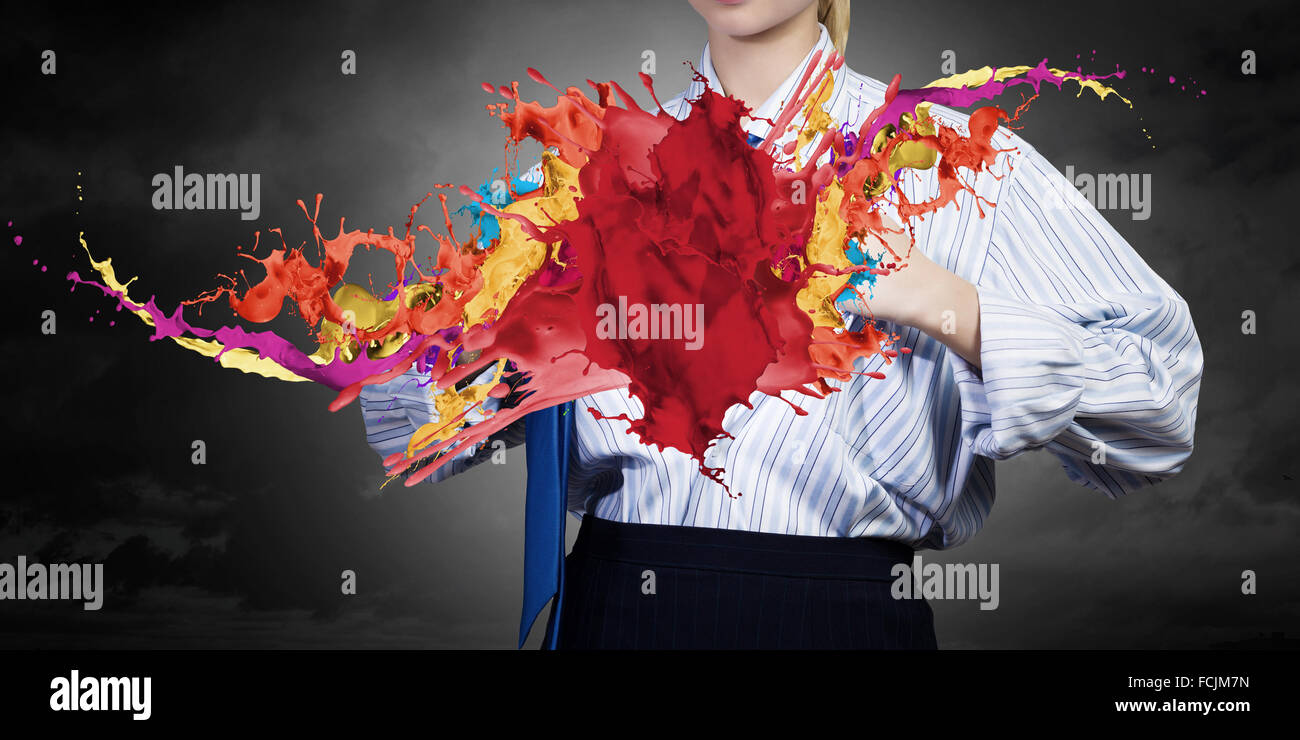 Young woman tearing shirt on chest and splashes flying out Stock Photo ...
