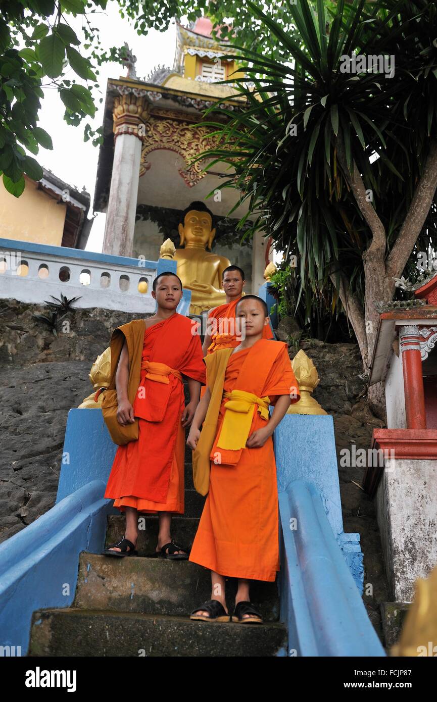 Three young monks laos hi-res stock photography and images - Alamy