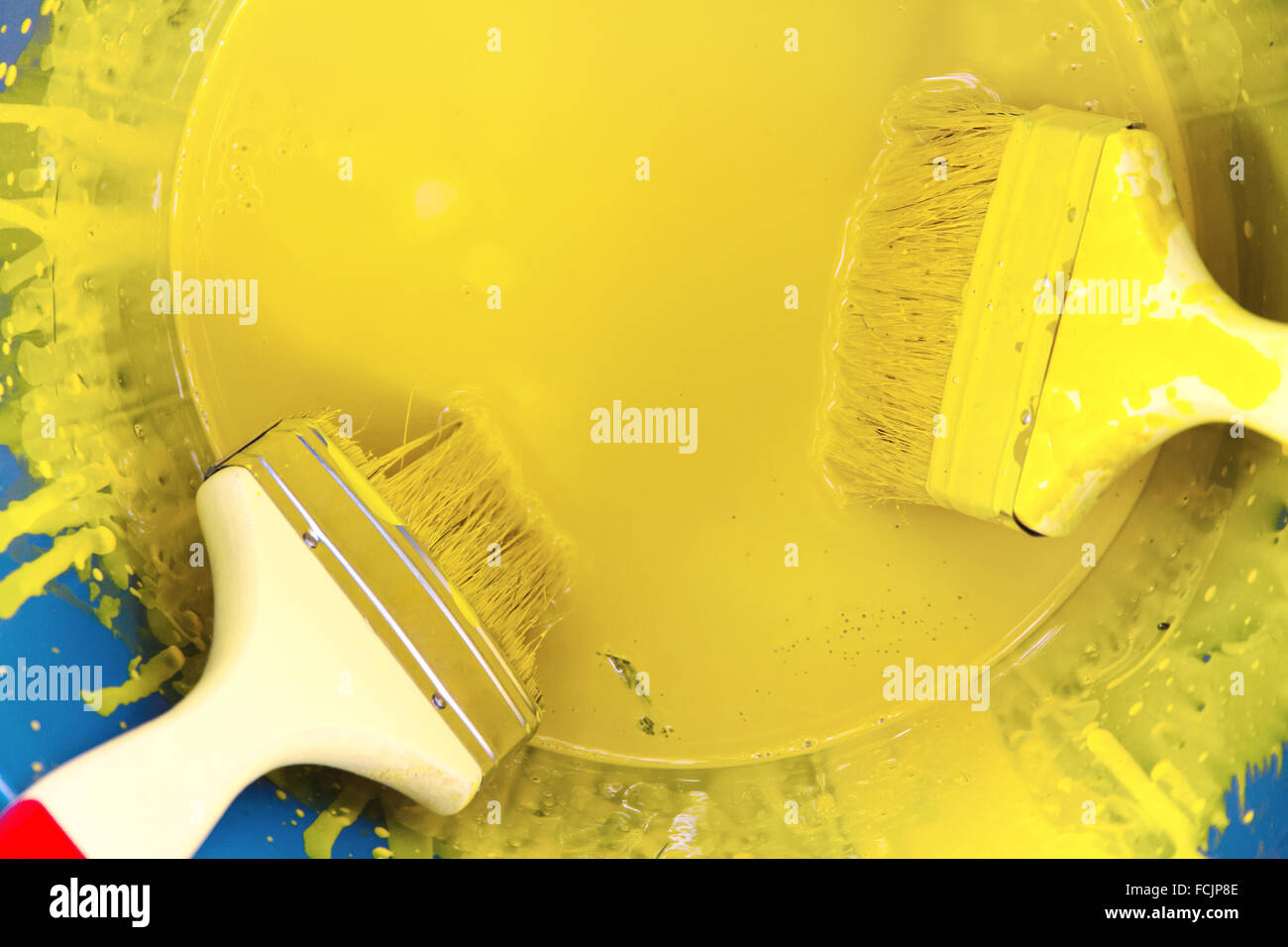 yellow paint can and brush Stock Photo - Alamy