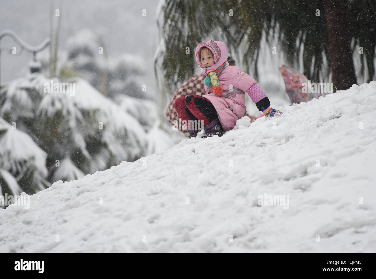 Chongqing. 23rd Jan, 2016. A girl enjoys snow fun in downtown Chongqing ...