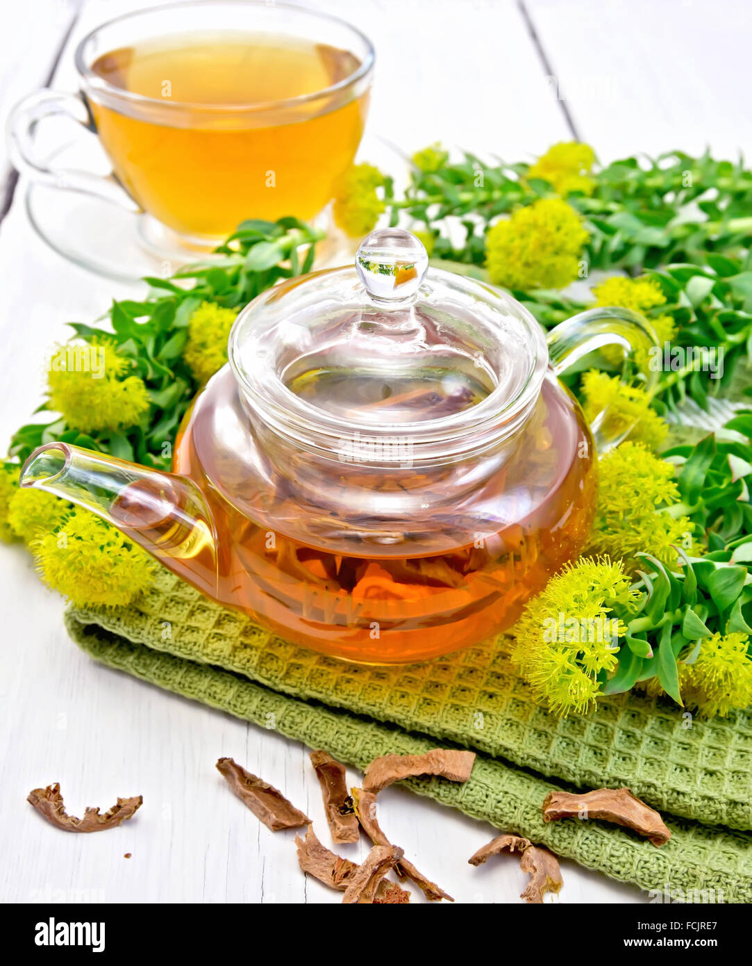 Herbal tea in a glass teapot from the root of Rhodiola rosea on a ...