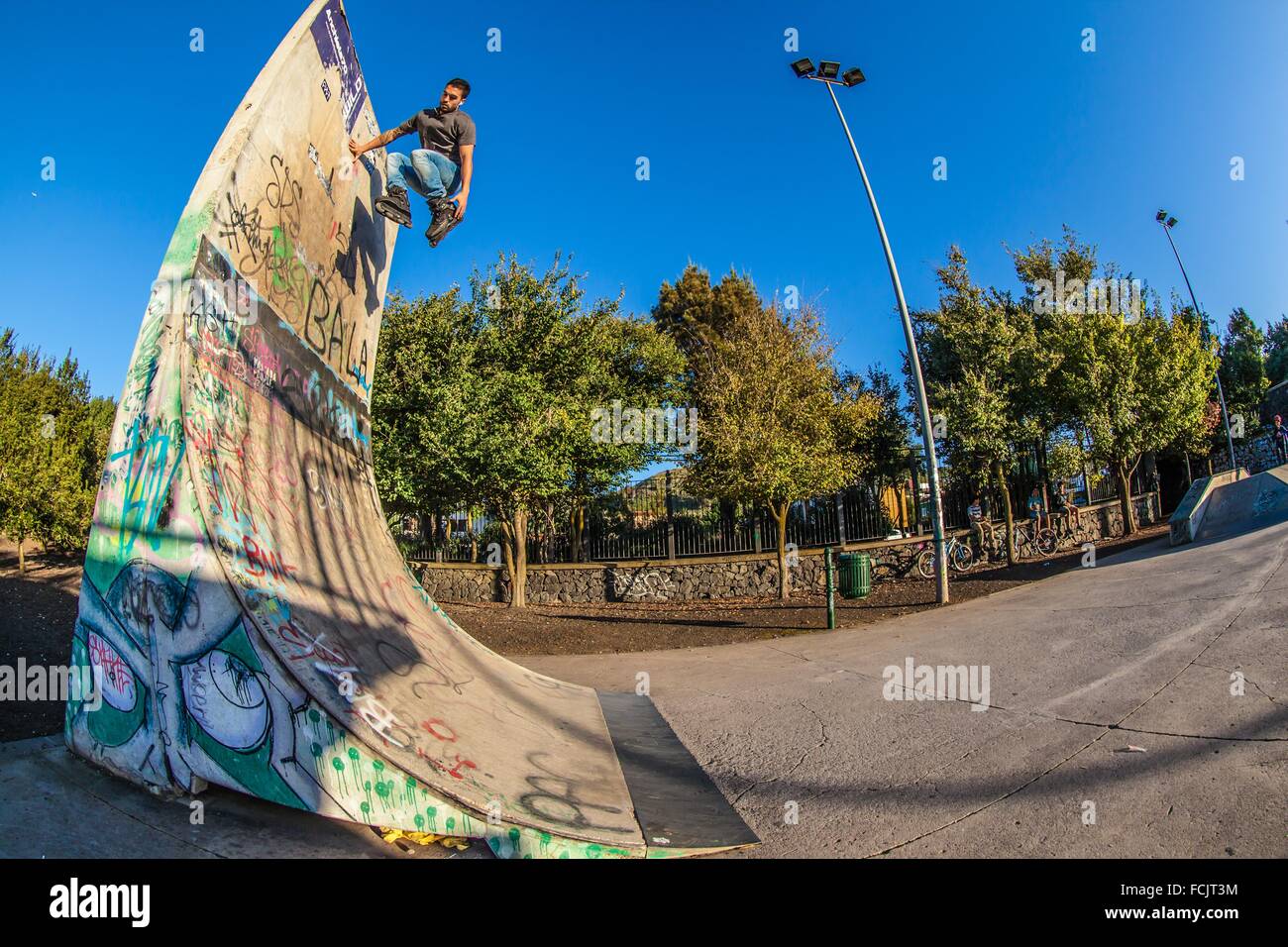 Boy inline skating outdoors hi-res stock photography and images - Alamy