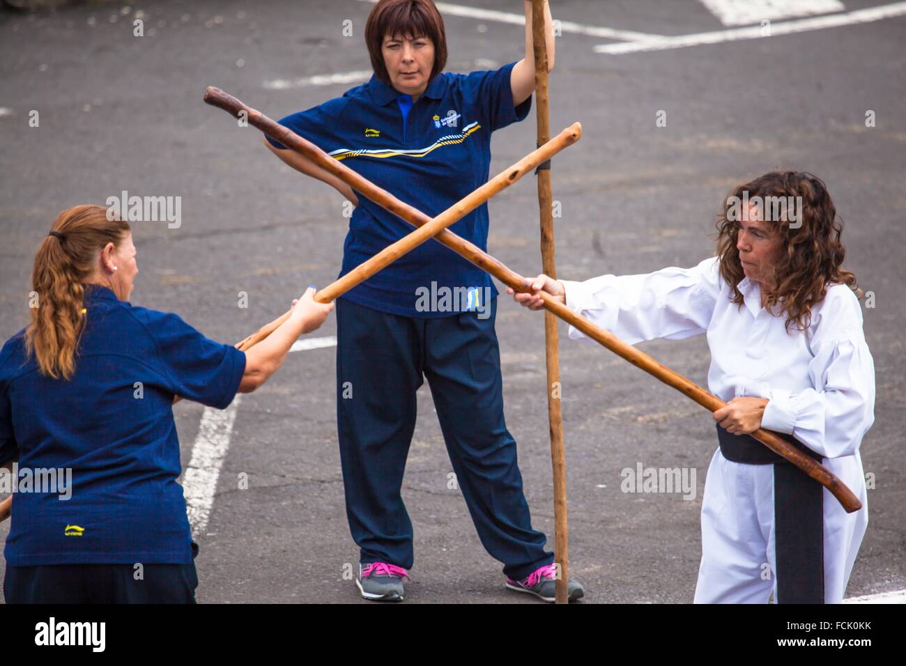 Women playing the canarian stick fight in a public exhibition in the ...
