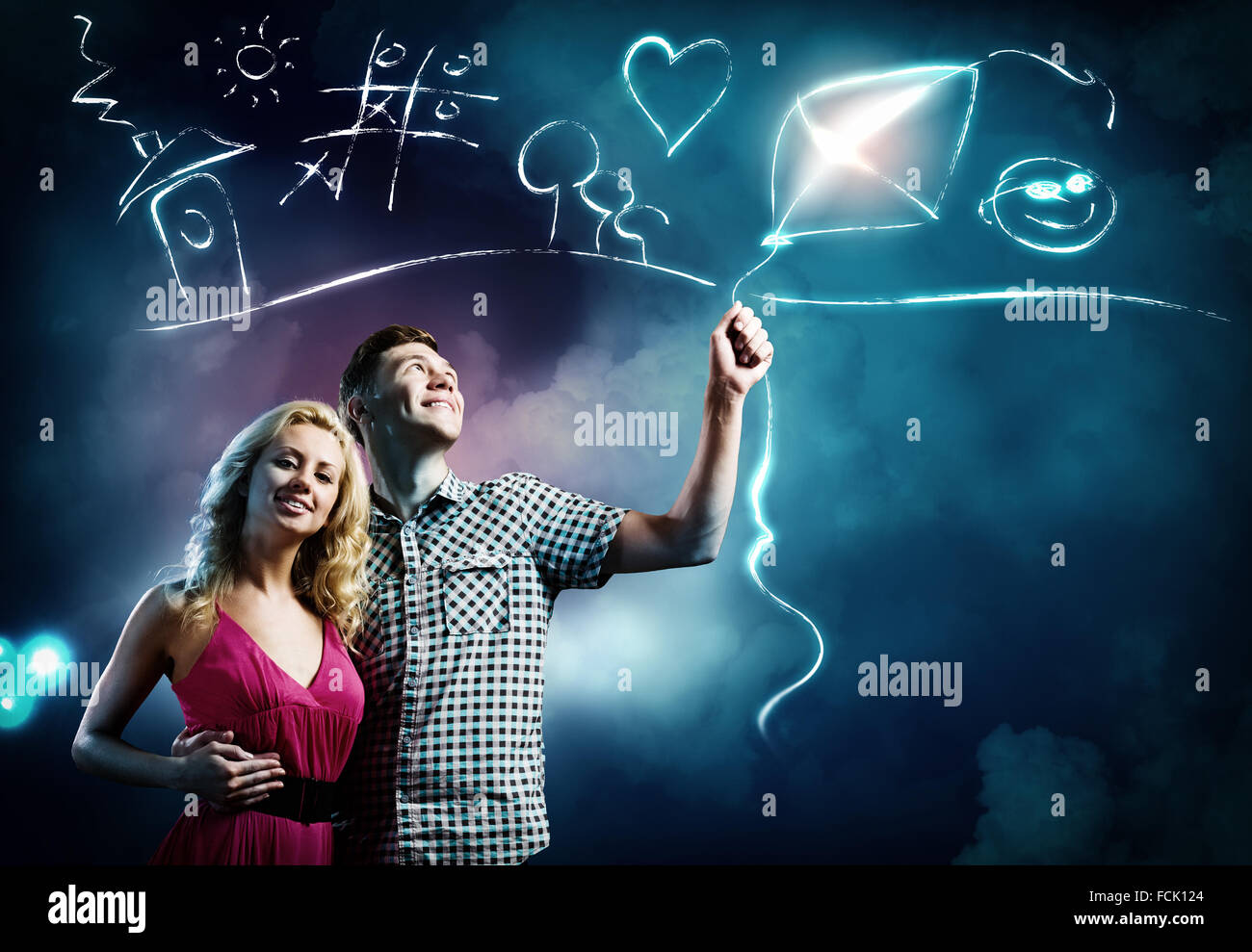 Young happy couple dreaming about family and future life Stock Photo ...