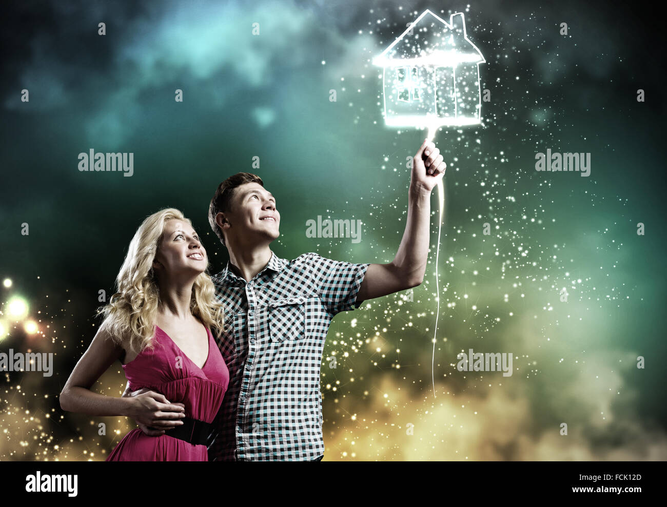 Young happy couple dreaming about family and future life Stock Photo ...