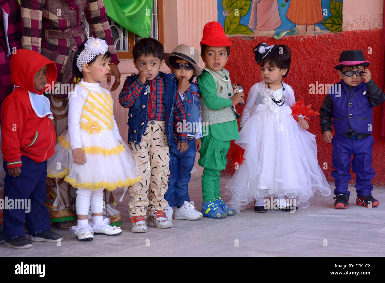 Little children participate in a fashion show in a first step school at ...