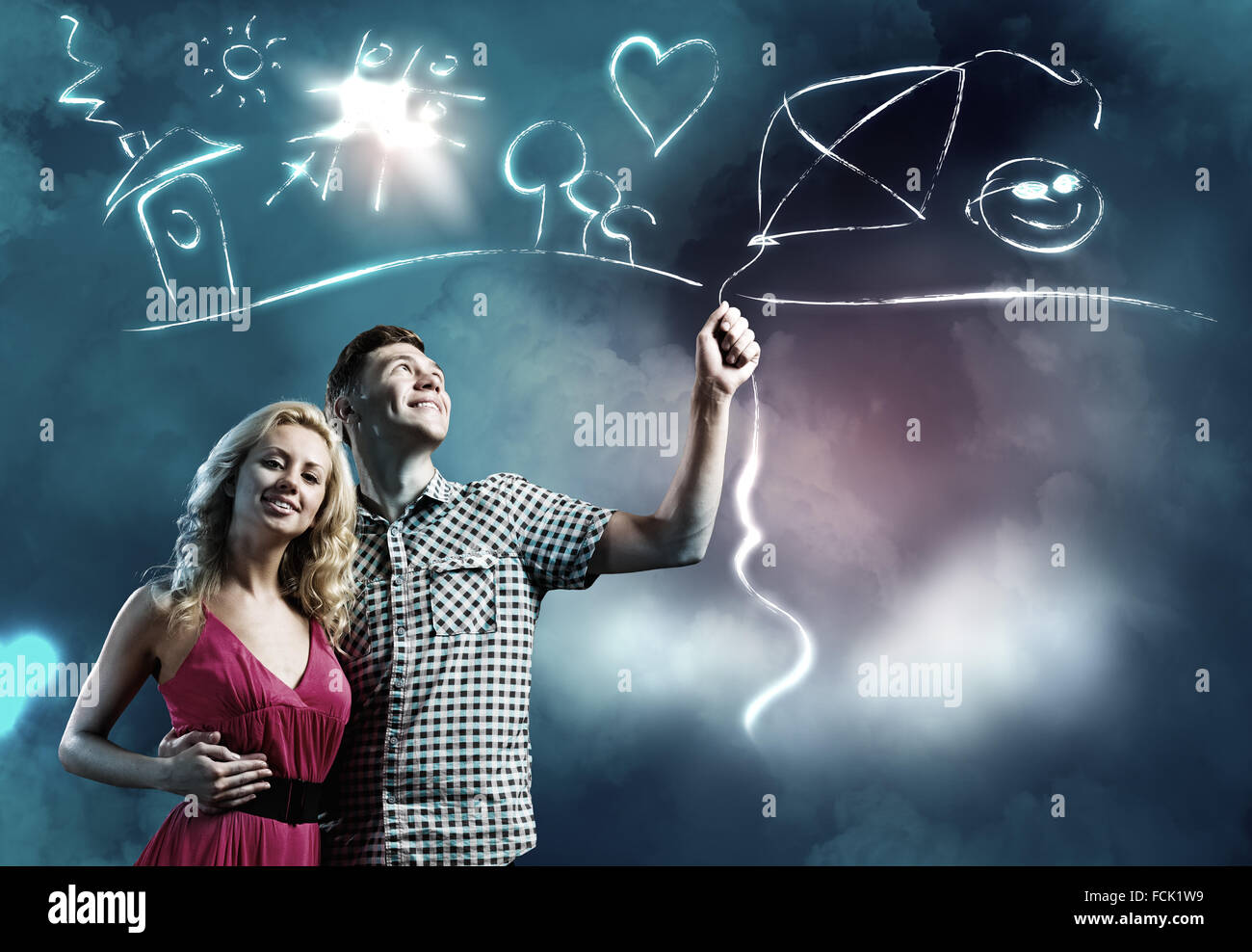 Young happy couple dreaming about family and future life Stock Photo ...