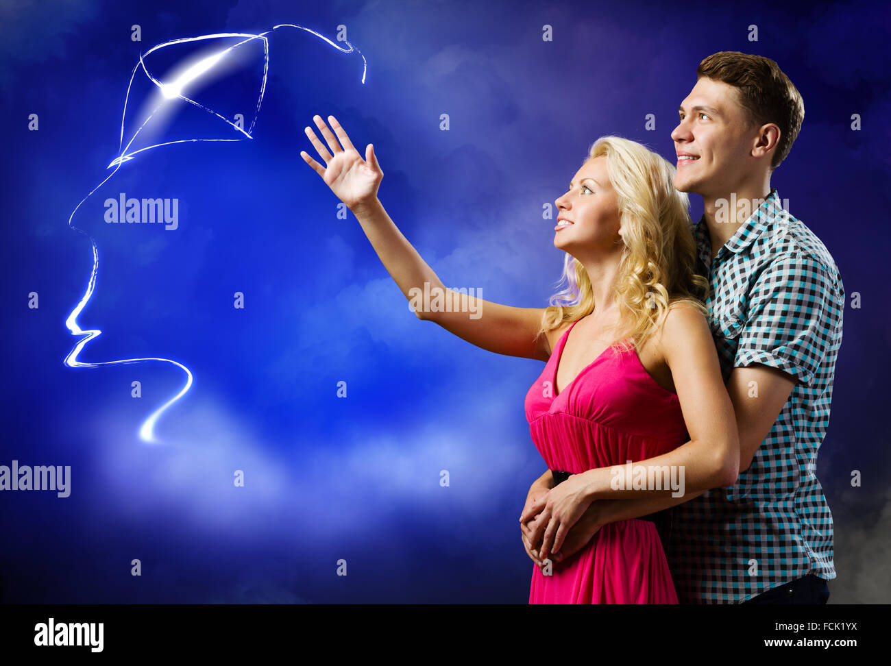 Young happy couple dreaming about family and future life Stock Photo ...