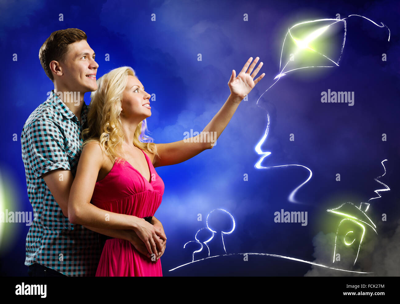 Young happy couple dreaming about family and future life Stock Photo ...