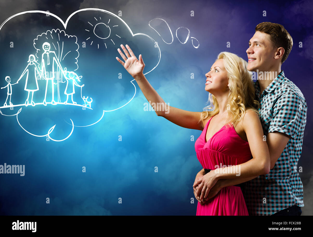 Young happy couple dreaming about family and future life Stock Photo ...