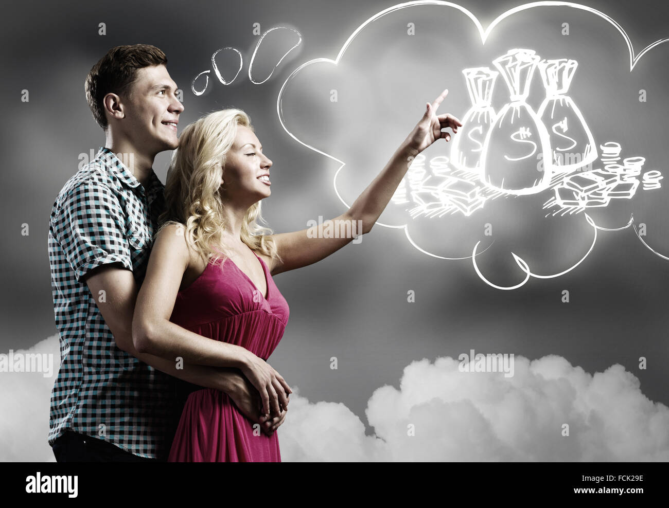Young happy couple dreaming about future life Stock Photo - Alamy