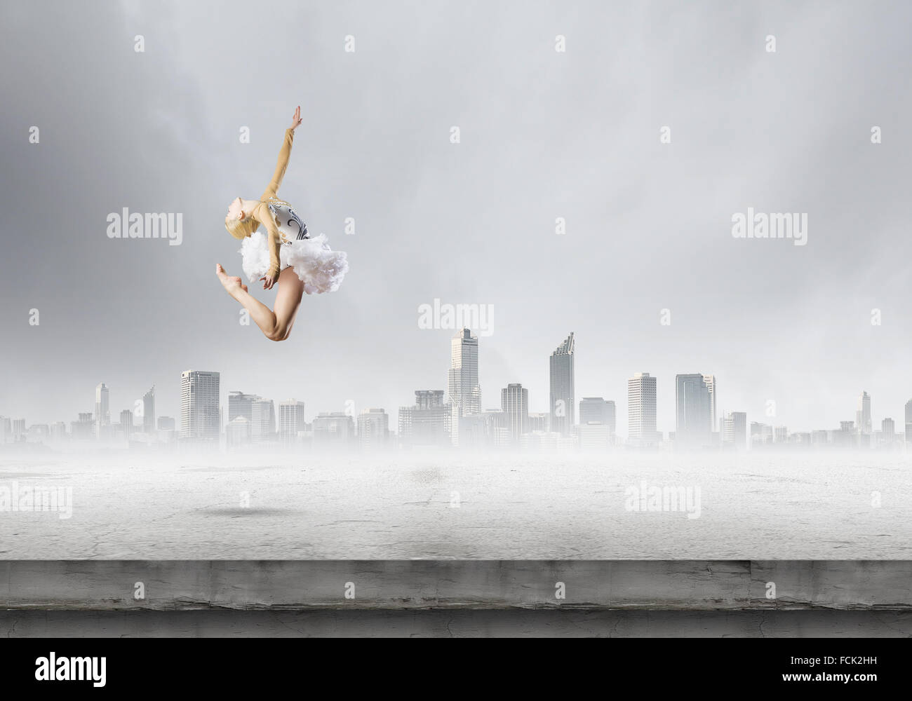 Young girl dancer jumping high in sky Stock Photo - Alamy