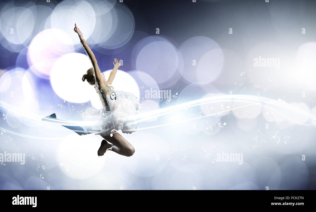 Young pretty ballerina girl making jump in dance Stock Photo - Alamy