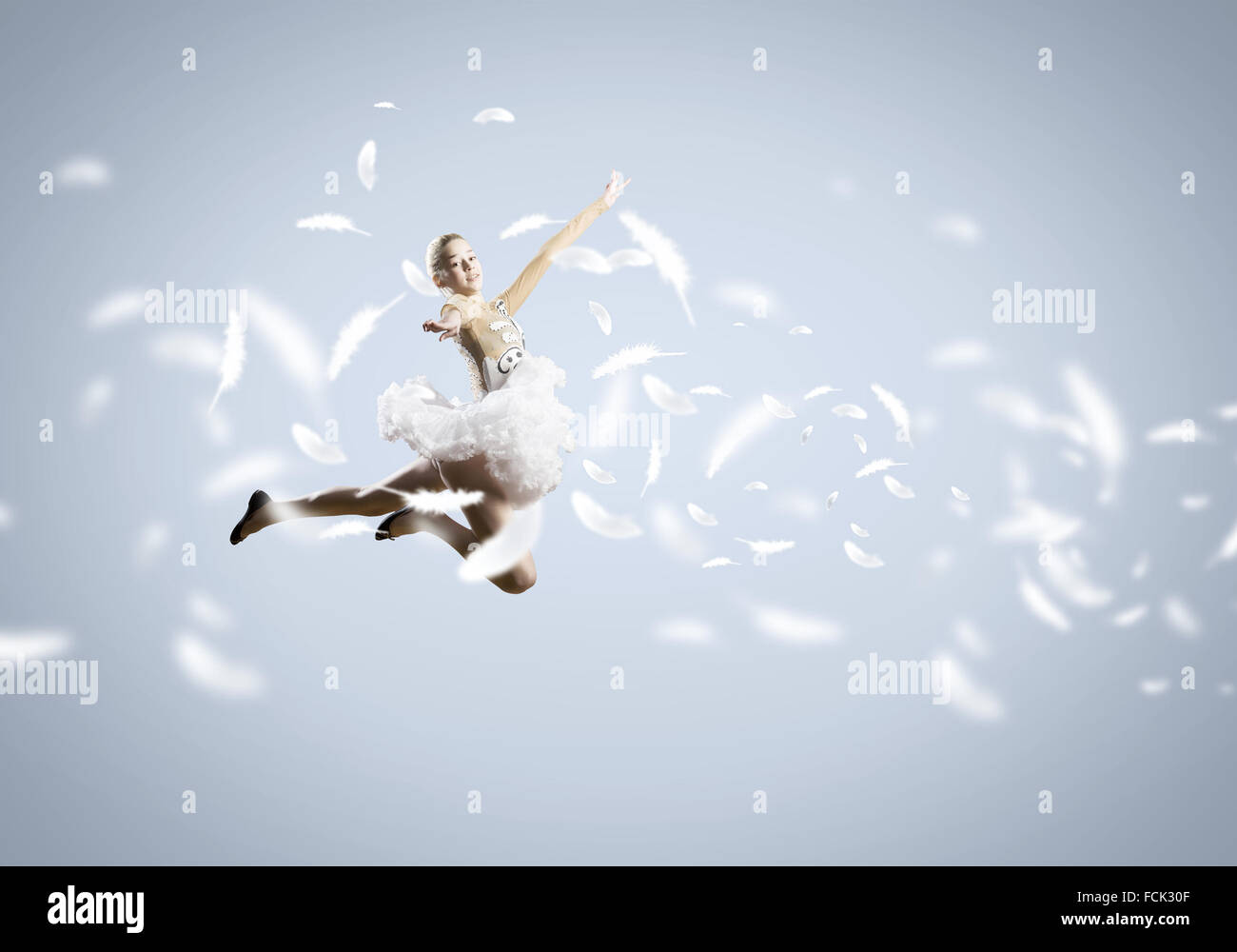 Young pretty ballerina girl making jump in dance Stock Photo - Alamy