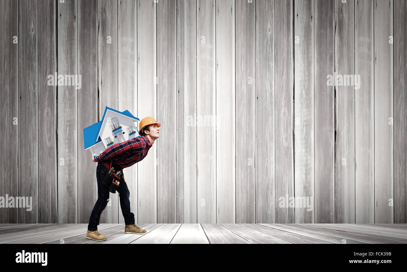 Builder carrying building block hi-res stock photography and images - Alamy