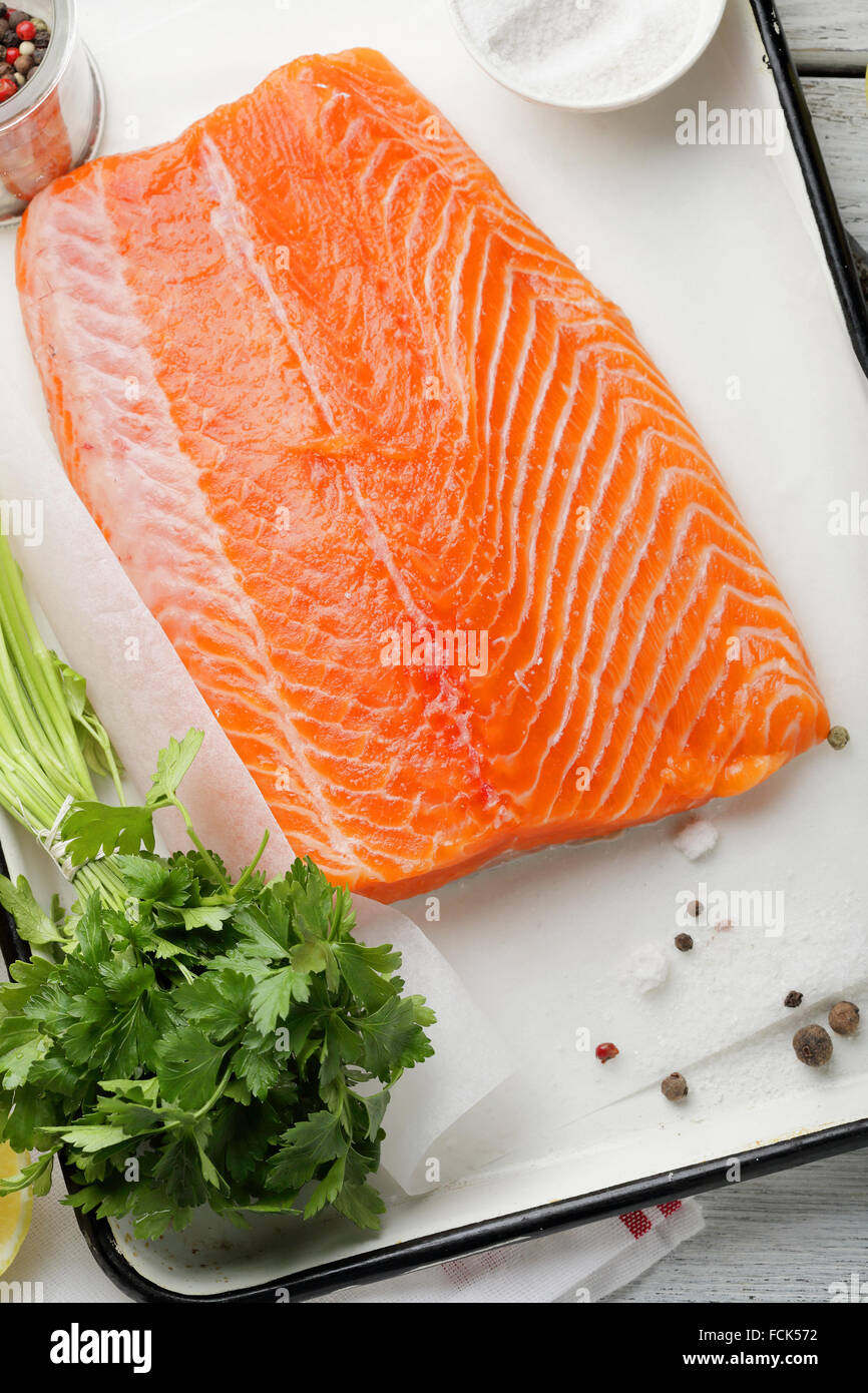 trout fillet with spice on white tray, food close-up Stock Photo - Alamy
