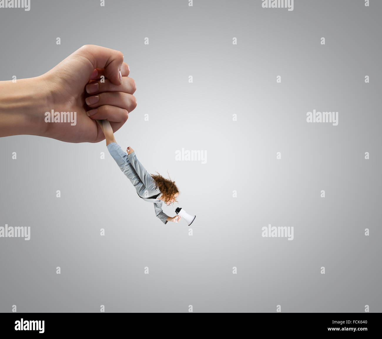 Close up of big human hand catching businesswoman Stock Photo - Alamy