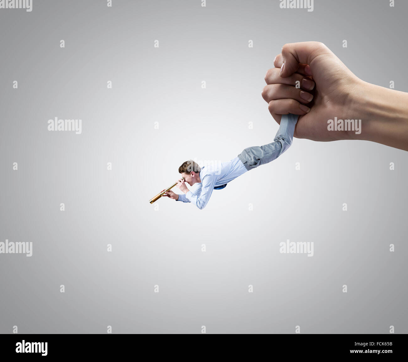 Close up of big human hand catching businessman Stock Photo - Alamy