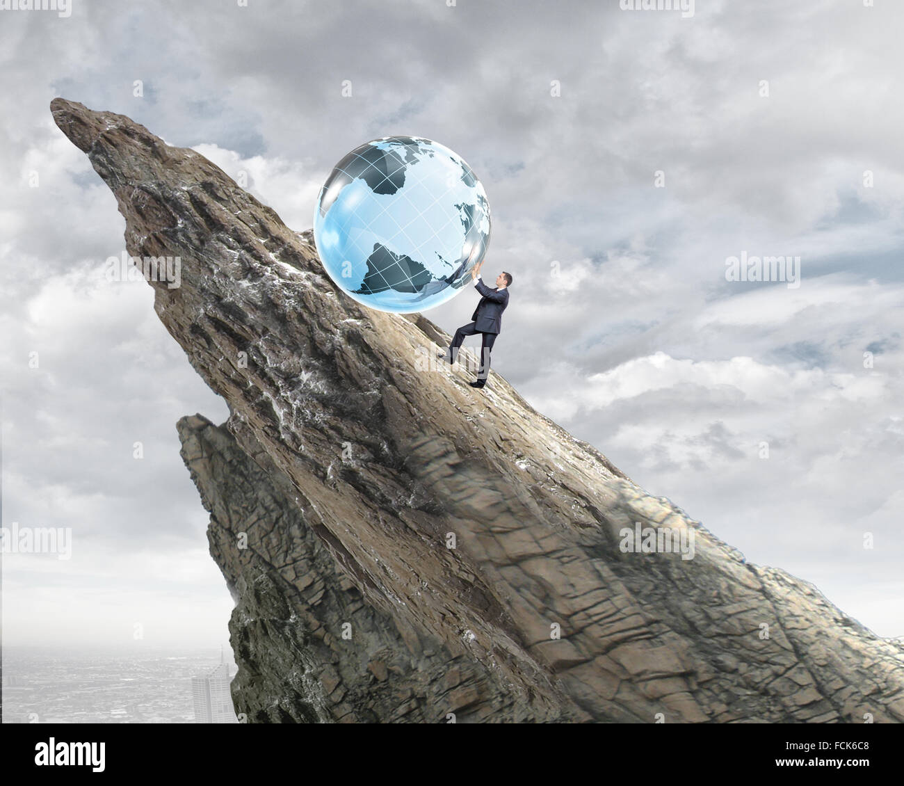Young businessman rolling Earth planet up th hill Stock Photo - Alamy