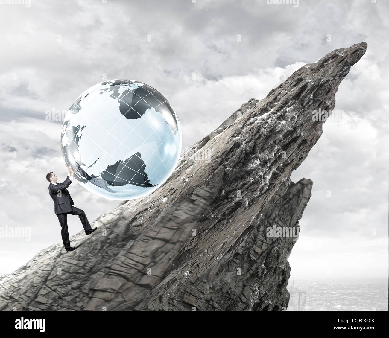 Young businessman rolling Earth planet up th hill Stock Photo - Alamy