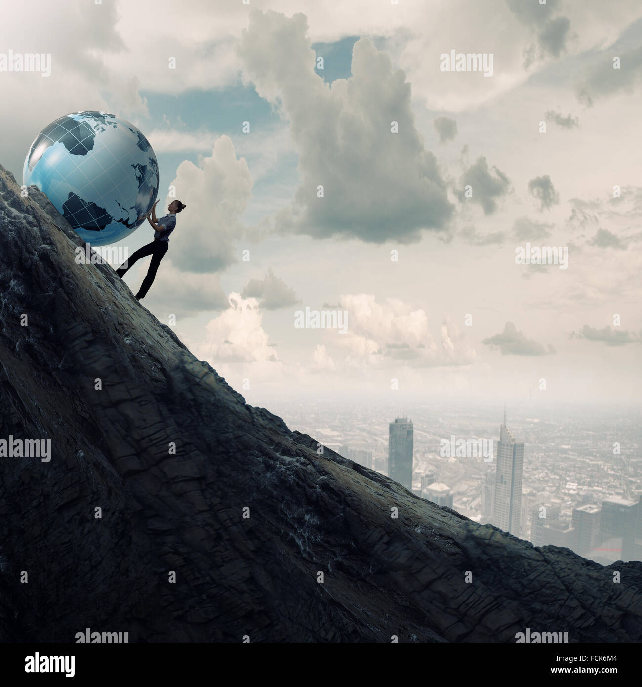 Young businesswoman rolling Earth planet up th hill Stock Photo - Alamy